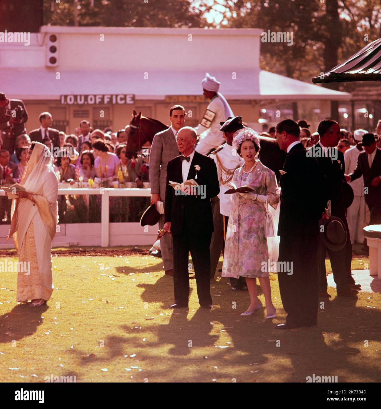 A vintage colour photograph showing Queen Elizabeth II in the paddock ...
