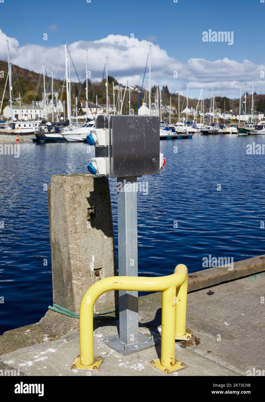 Electrical hook up point on the quay at East Loch Tarbert. Argyll and ...