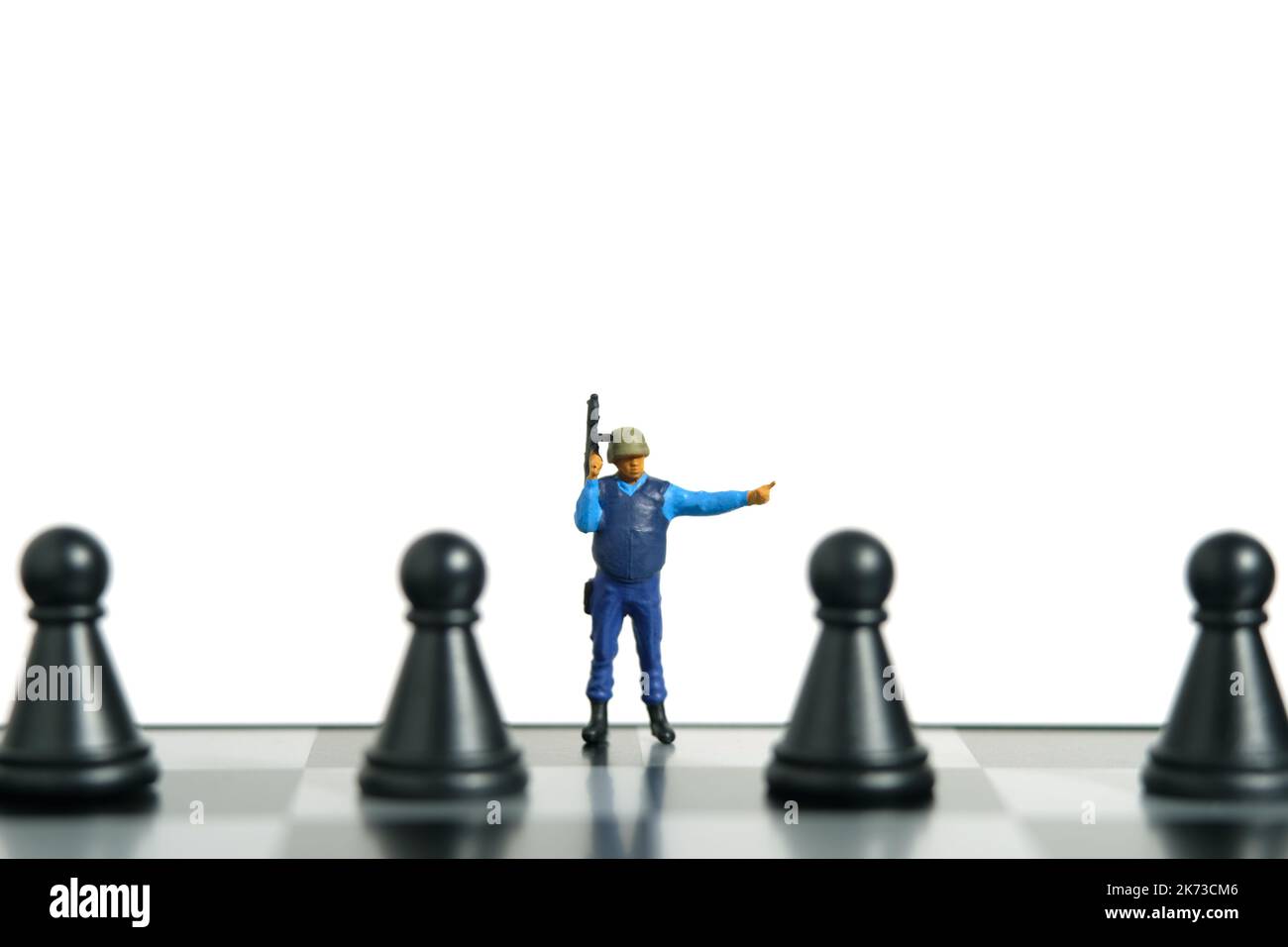 Miniature people toy figure photography. Protection strategy concept. A ...