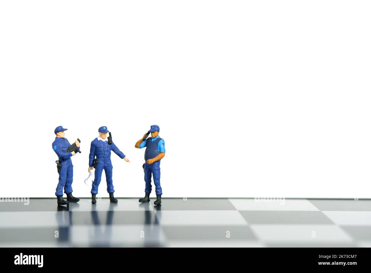 Miniature people toy figure photography. Protection strategy concept. A ...