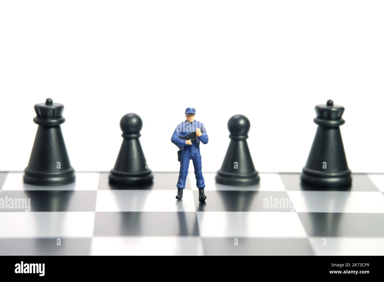 Miniature people toy figure photography. Protection strategy concept. A ...