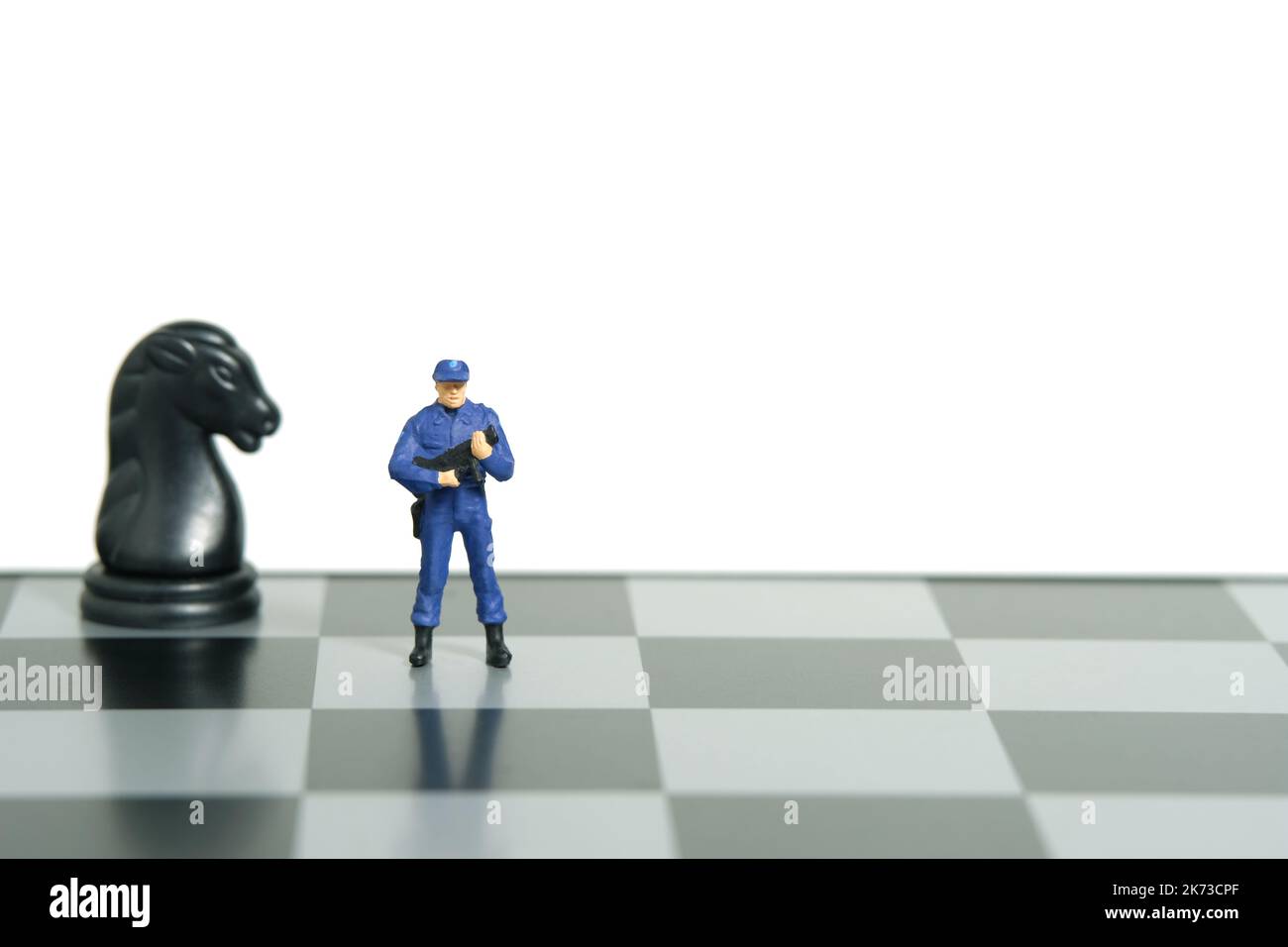 Miniature people toy figure photography. Protection strategy concept. A ...