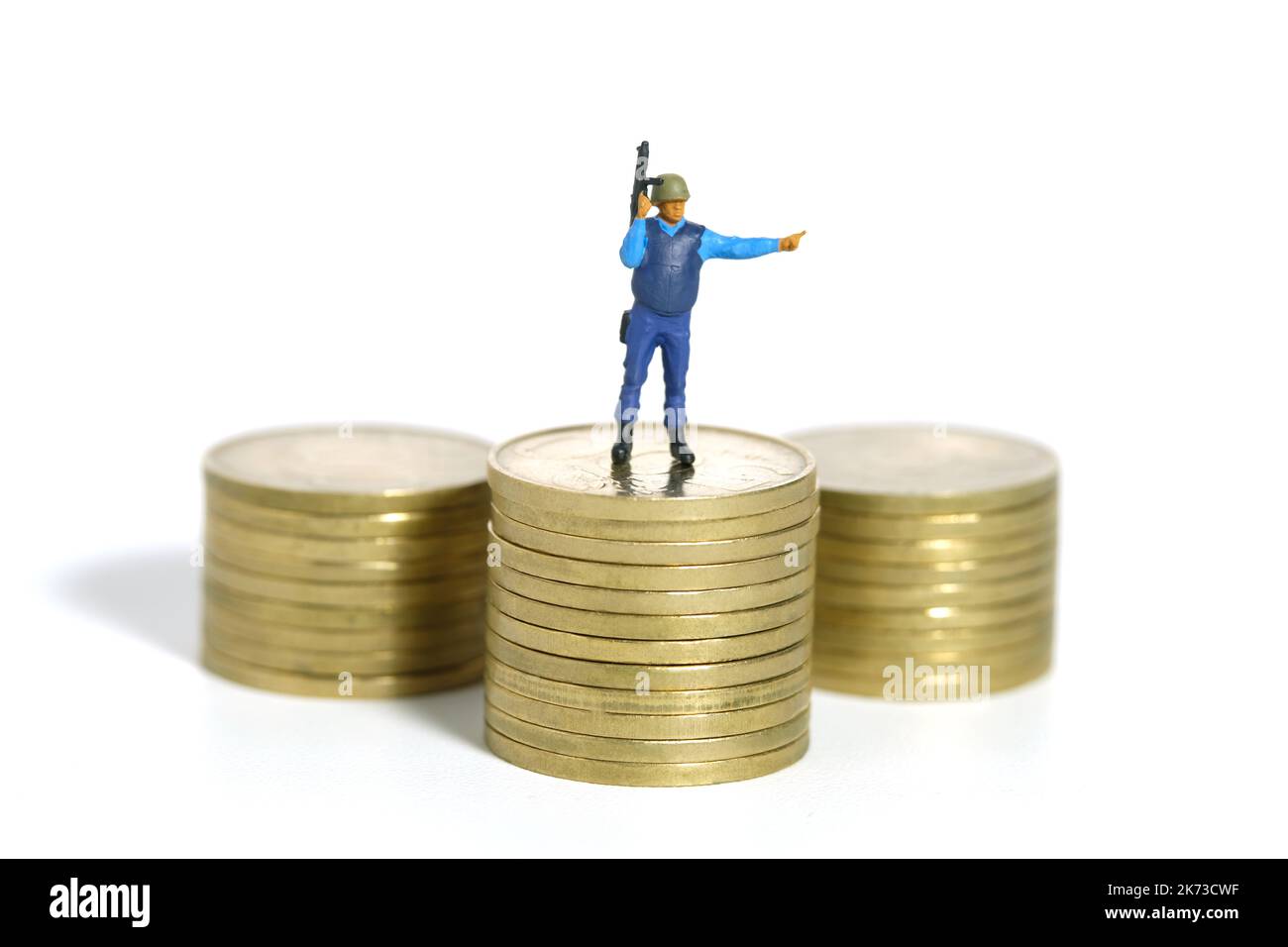 Miniature people toy figure photography. Money protection concept. A ...