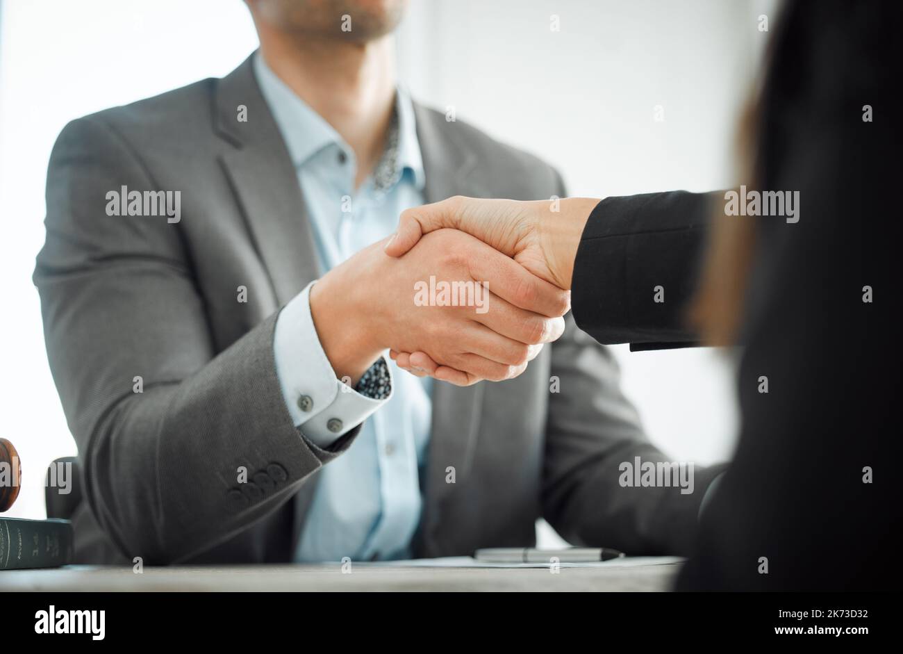 Im so happy to help. two businesspeople shaking hands Stock Photo - Alamy