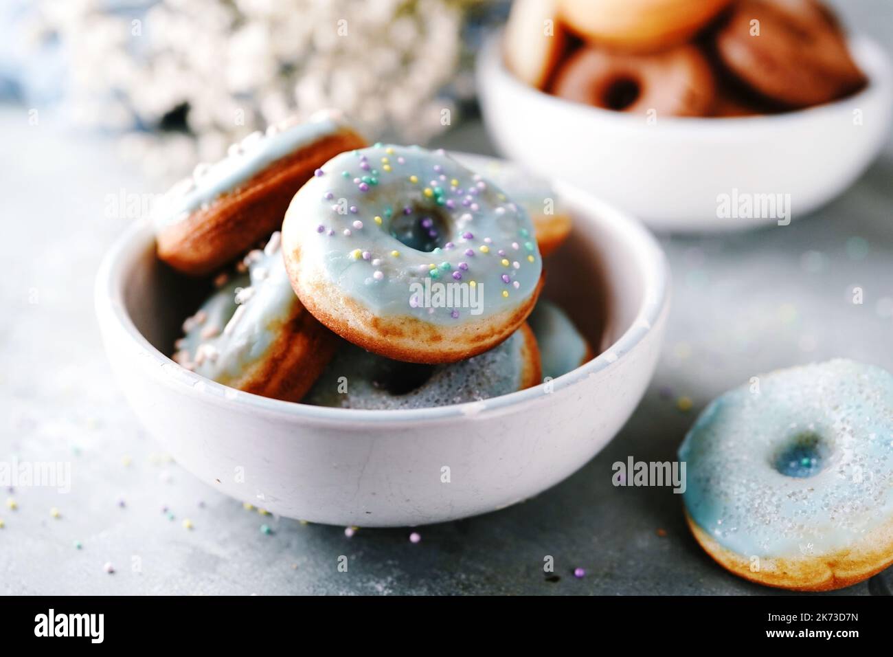 Homemade Mini Donuts Doughnuts with light blue frosting, selective ...