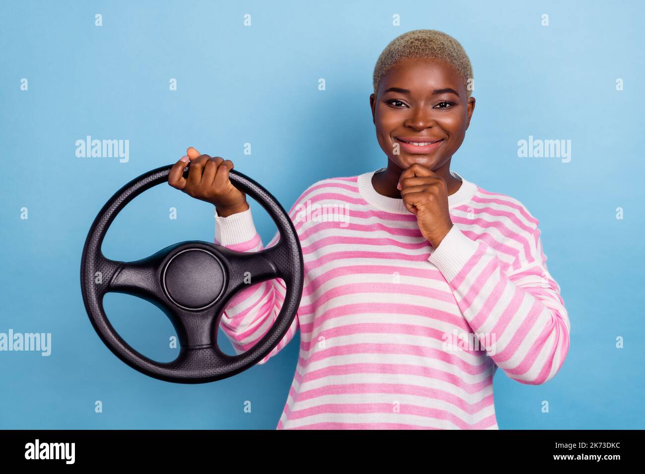 Portrait of minded girl arms fingers touch face trendy clothes decide ...