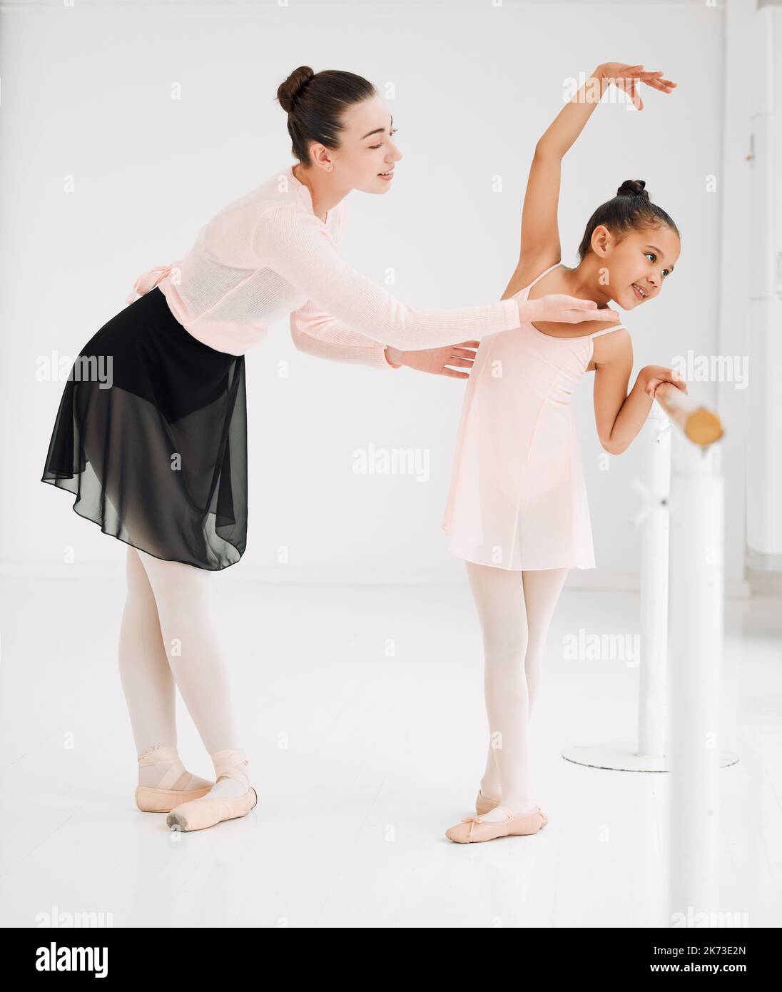 Remember to control your face too. a little girl practicing ballet with ...
