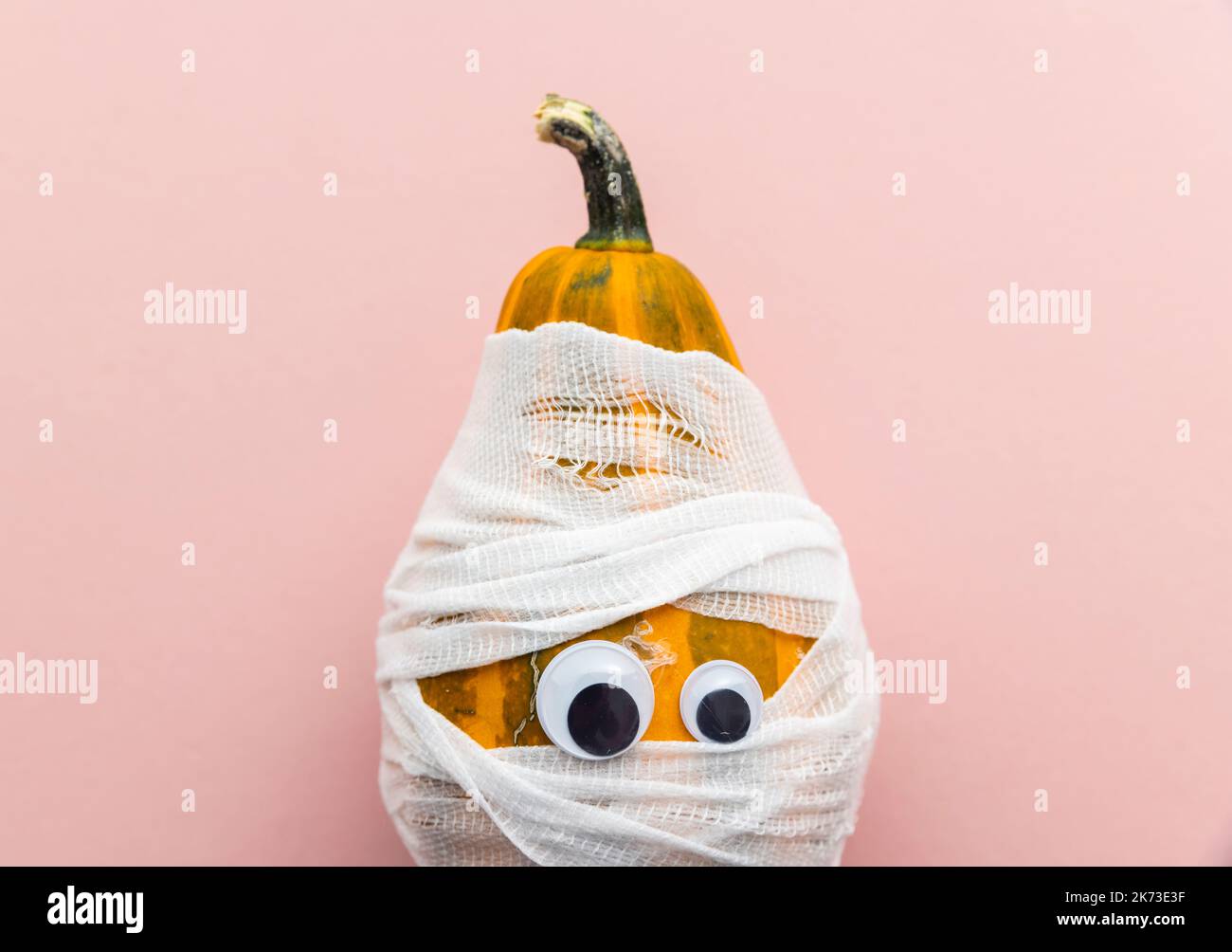 Hallowwen holiday background concept. Gourd pumpkins dressed as scary ...