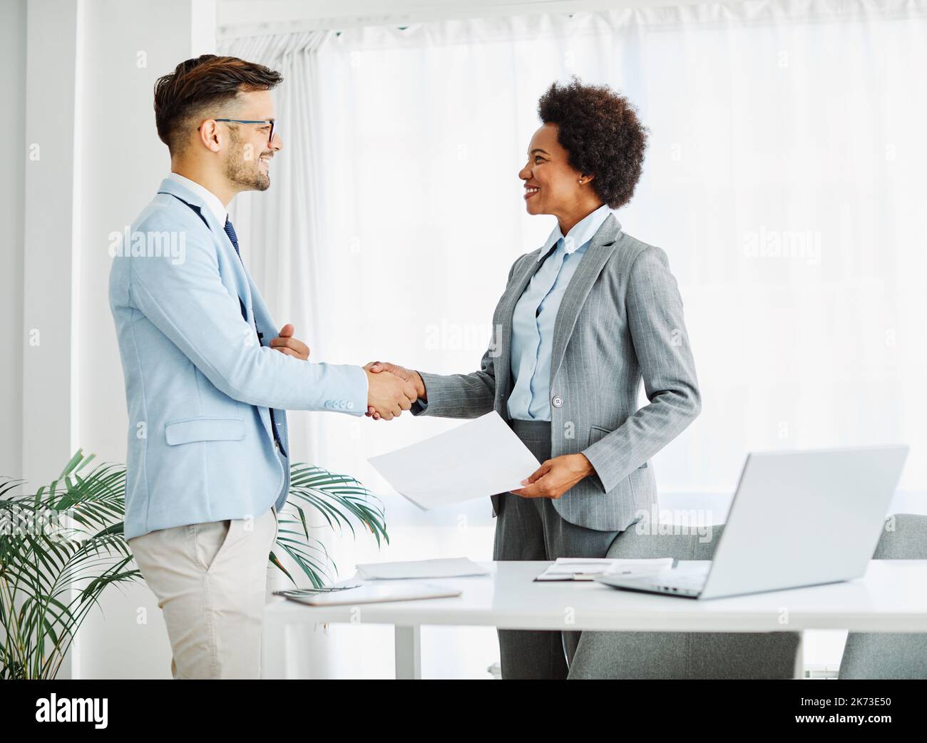 young business people meeting office teamwork group success agreement handshake deal document ...