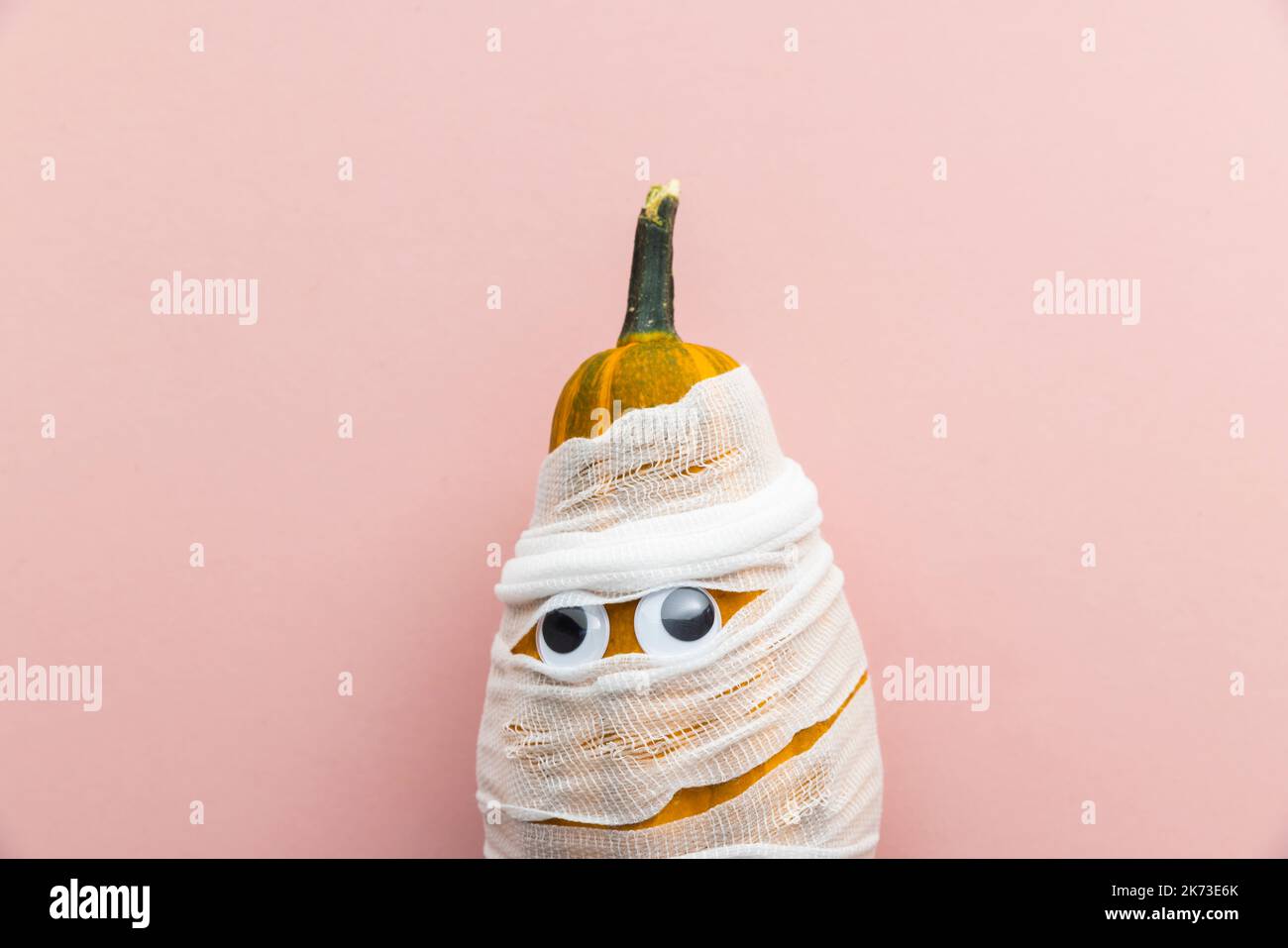 Hallowwen holiday background concept. Gourd pumpkins dressed as scary ...