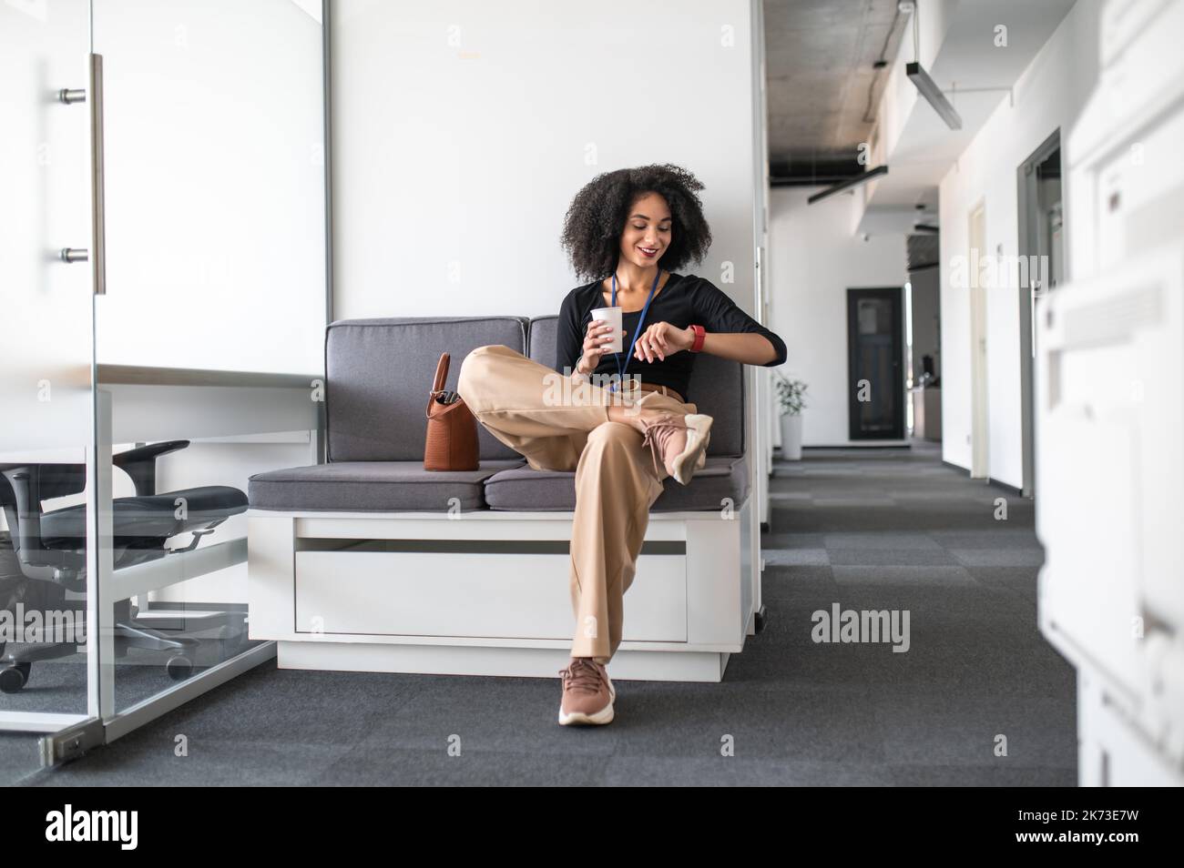 Pretty businesswoman having morning coffee in the office Stock Photo ...