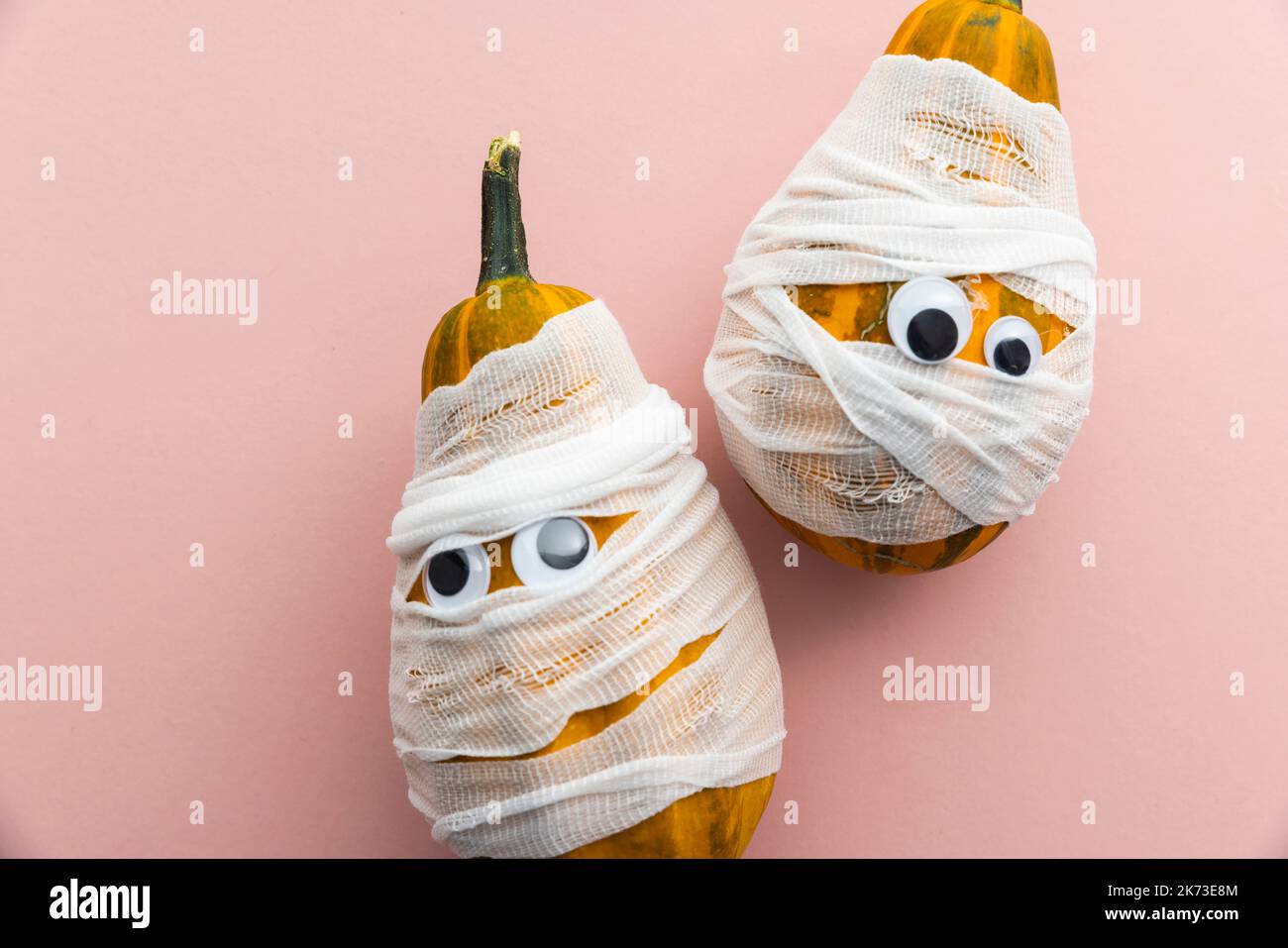 Hallowwen holiday background concept. Gourd pumpkins dressed as scary ...