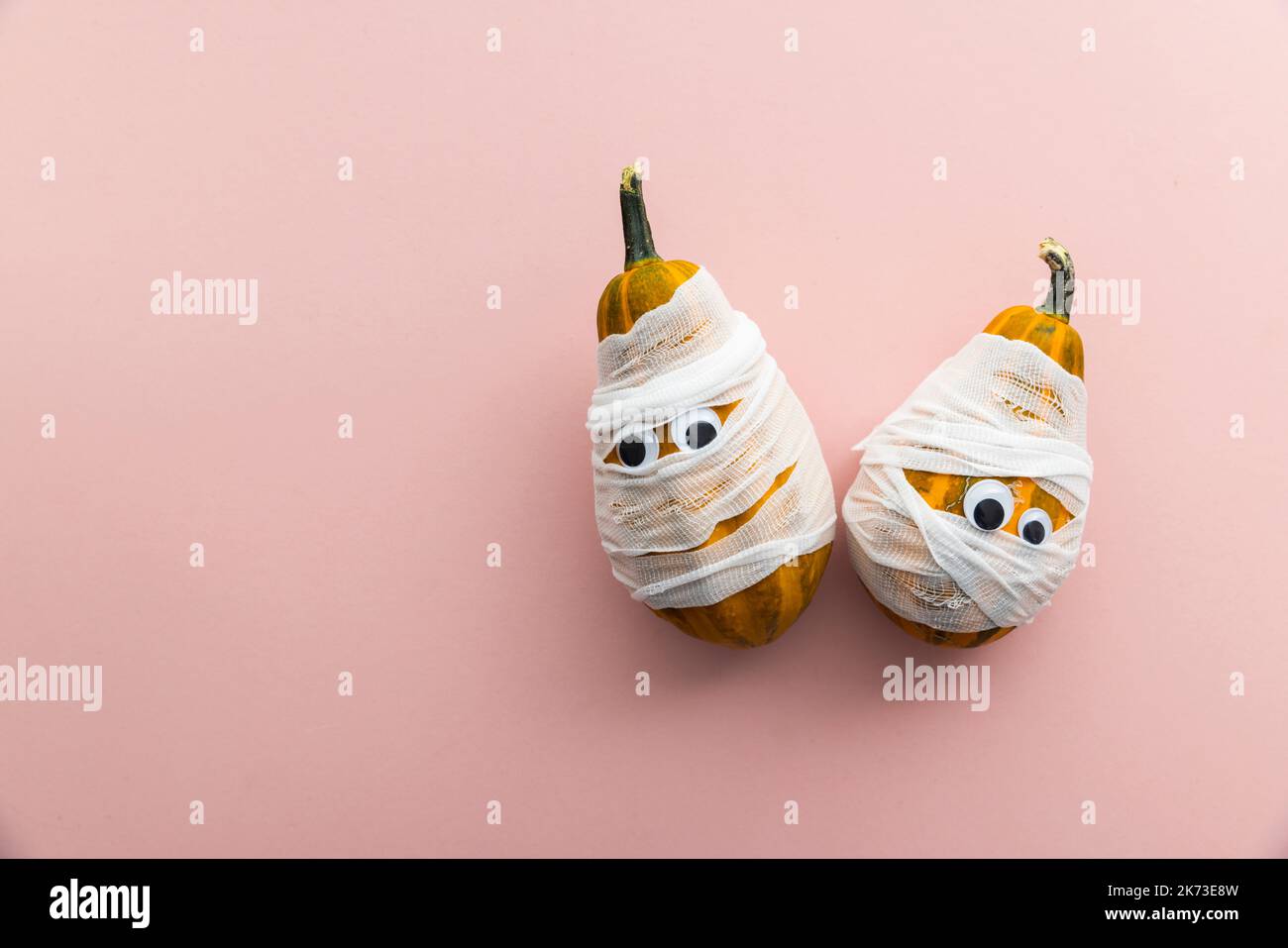 Hallowwen holiday background concept. Gourd pumpkins dressed as scary ...