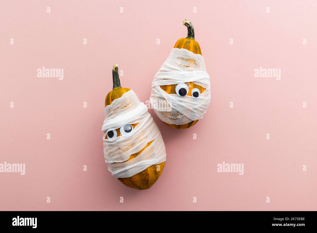 Hallowwen holiday background concept. Gourd pumpkins dressed as scary ...