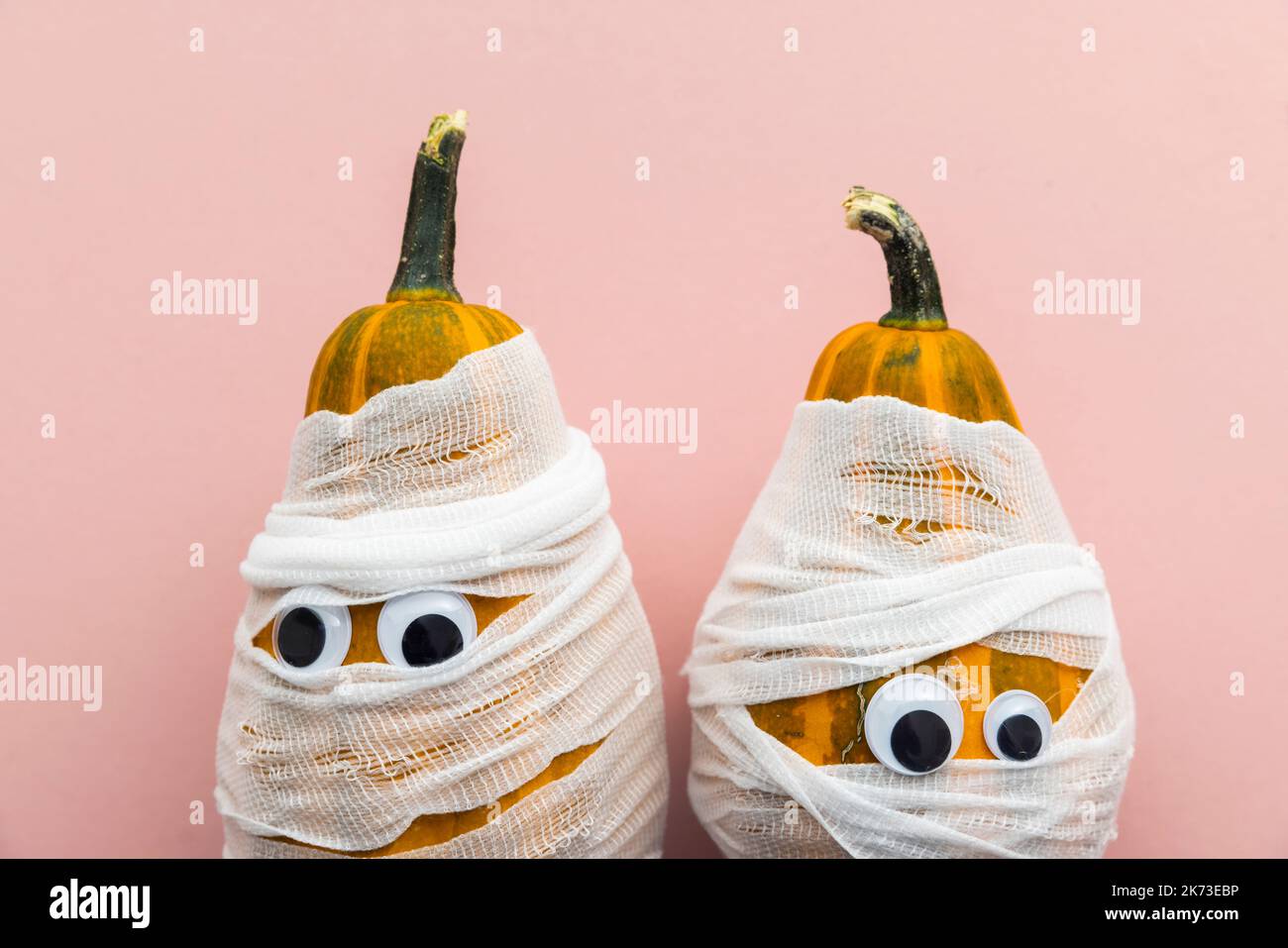 Hallowwen holiday background concept. Gourd pumpkins dressed as scary ...