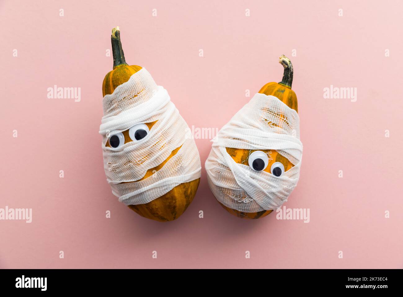 Hallowwen holiday background concept. Gourd pumpkins dressed as scary ...