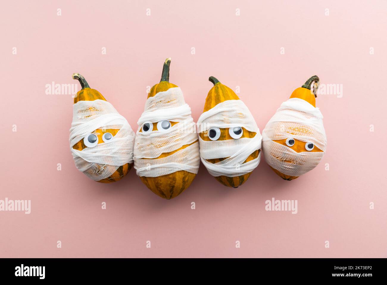 Hallowwen holiday background concept. Gourd pumpkins dressed as scary ...