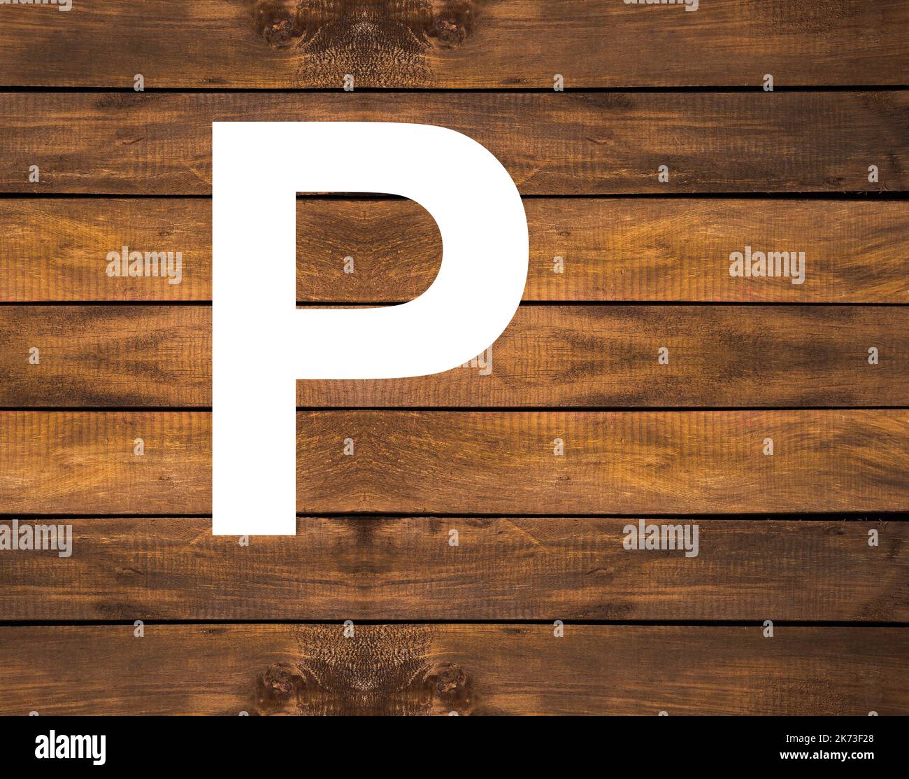Alphabet letter P in white hole on wood background Stock Photo - Alamy