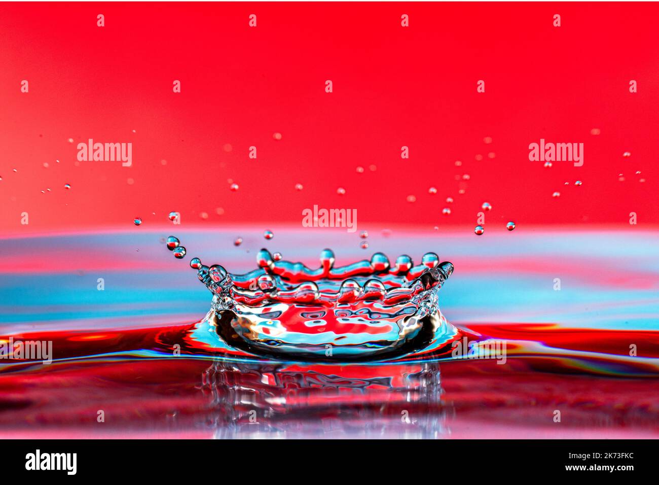 Colorful water drop splash on the surface Stock Photo - Alamy
