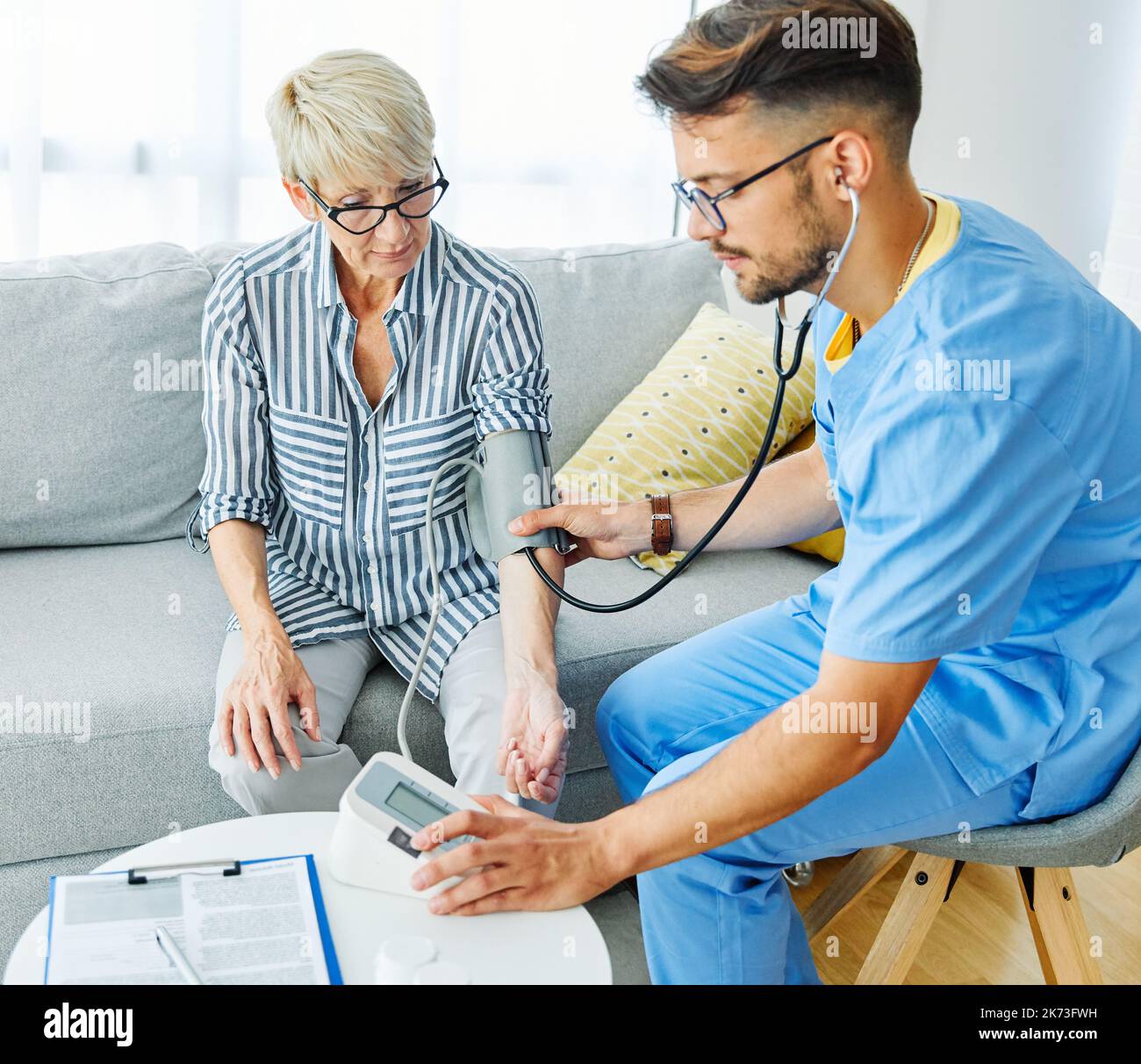 nurse doctor senior care caregiver help check exam blood pressure check ...
