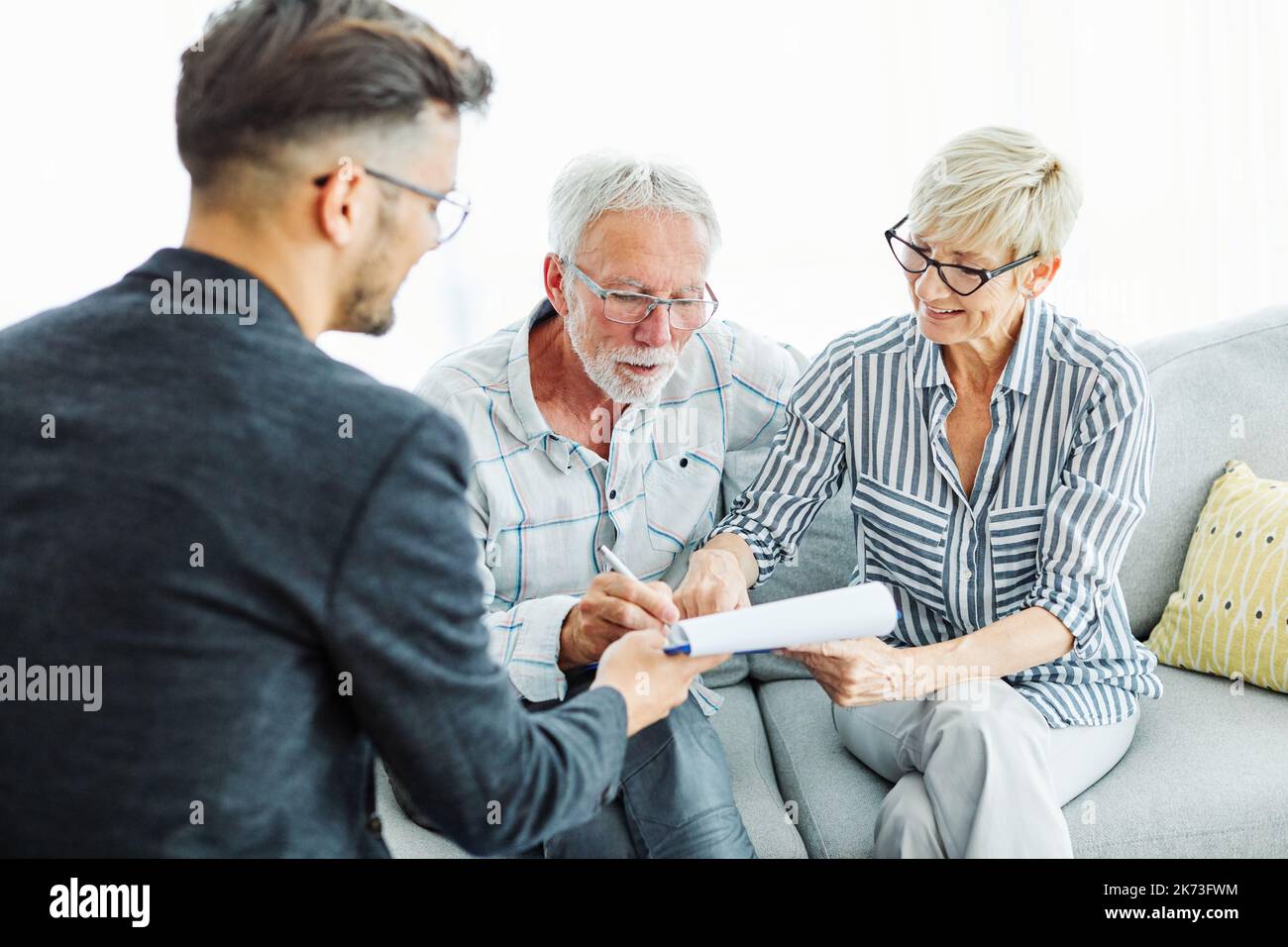 contract signing senior couple document investment business finance ...