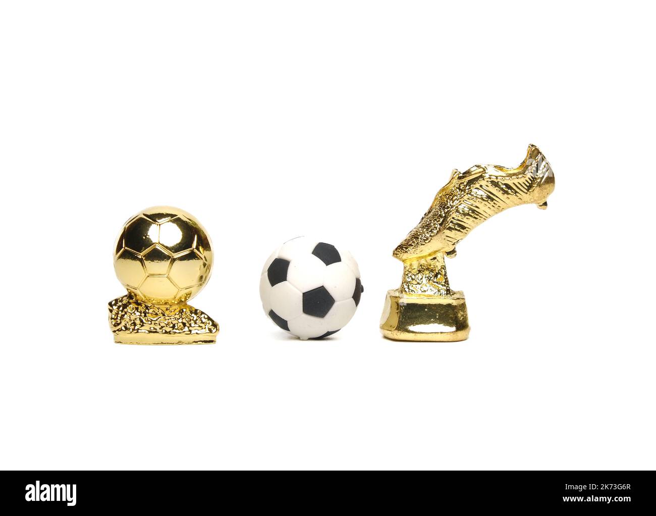 A picture of golden boots, golden ball and football on white background ...