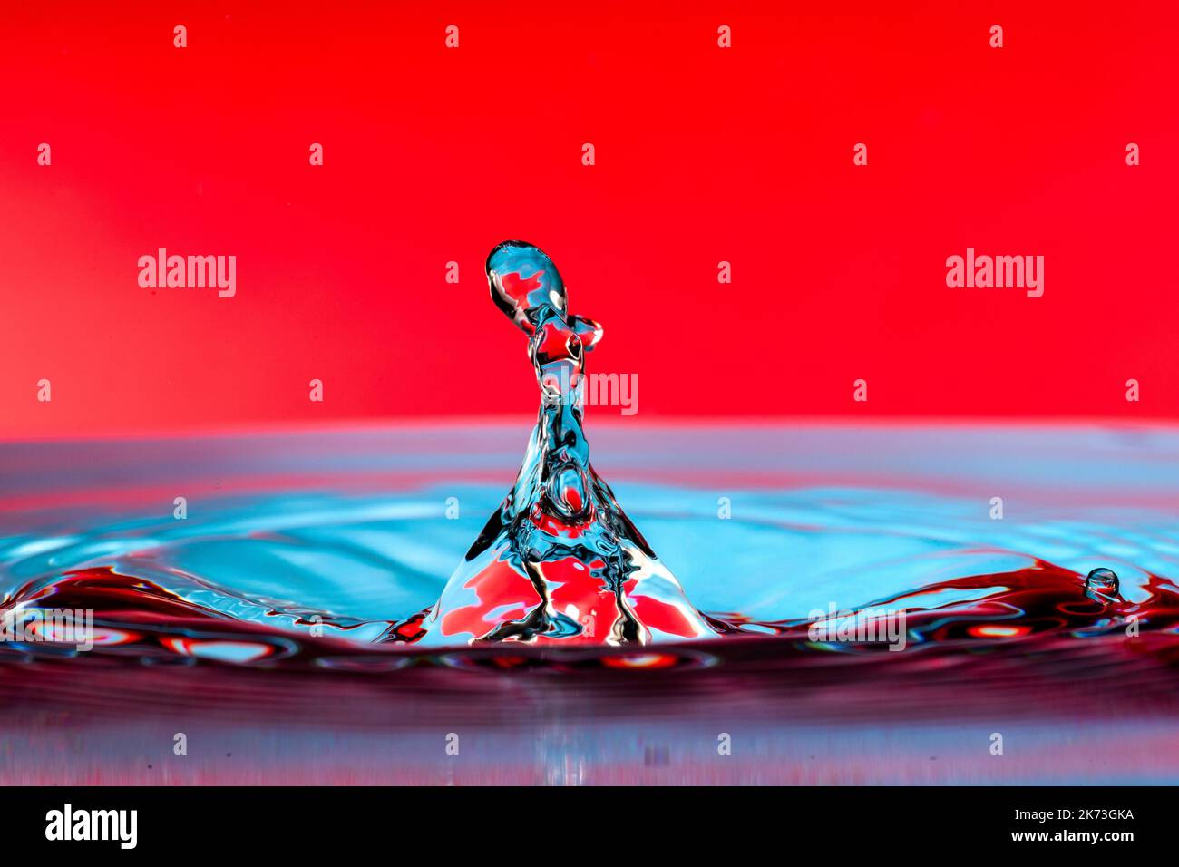 Colorful water drop splash on the surface Stock Photo - Alamy