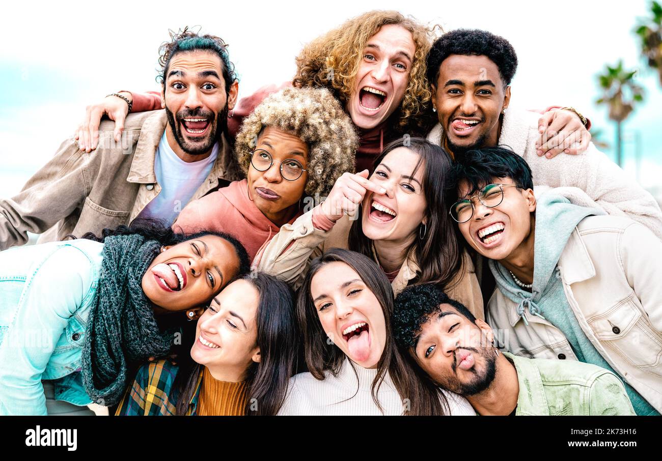 Multi cultural guys and girls taking best selfie outside on travel ...