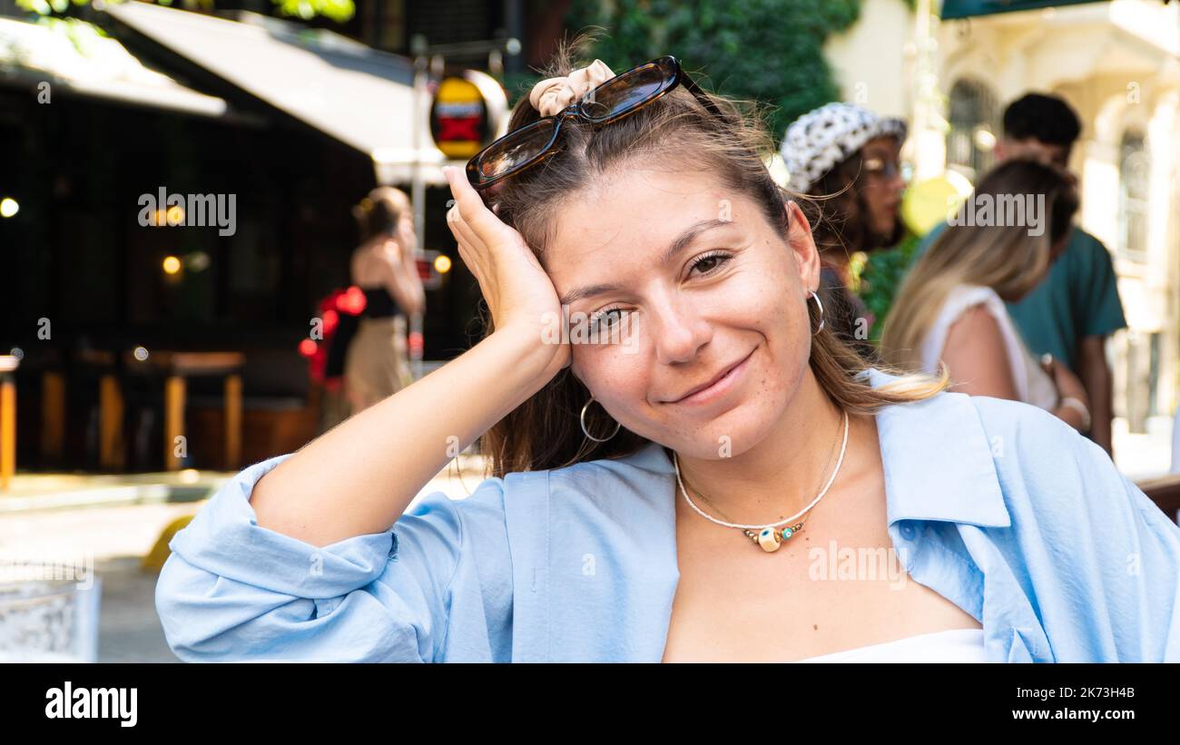 Young, attractive, beautiful woman smiling and looking at the camera ...