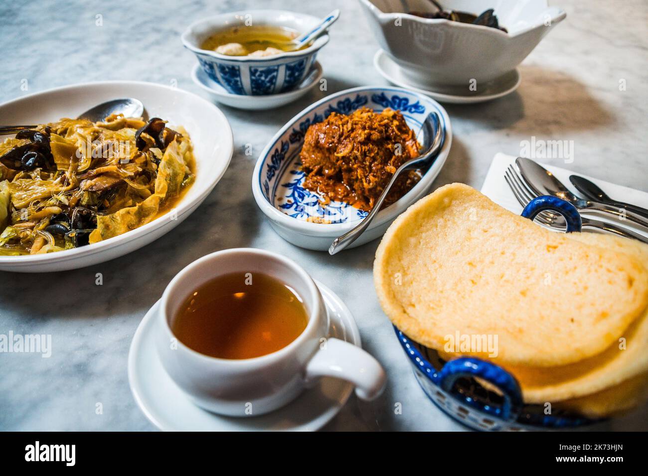 A Peranakan Chinese Malay mixed heritage cuisine meal of various dishes ...