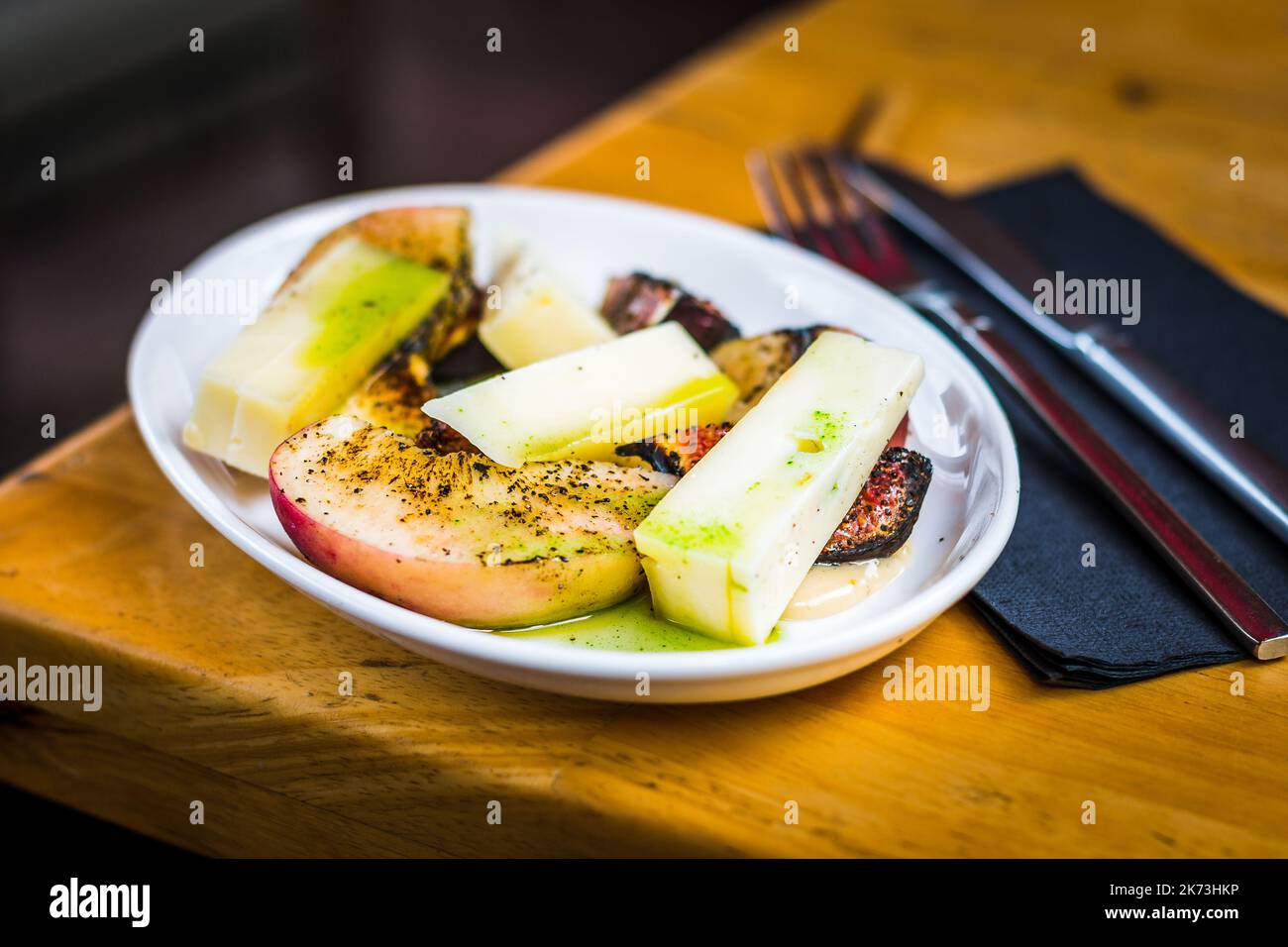 Fig & Peach appetiser of Grilled peach, grilled fig, taleggio cheese ...