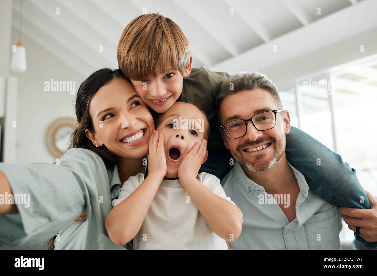 A familys love is binding for life. a family relaxing together at home ...