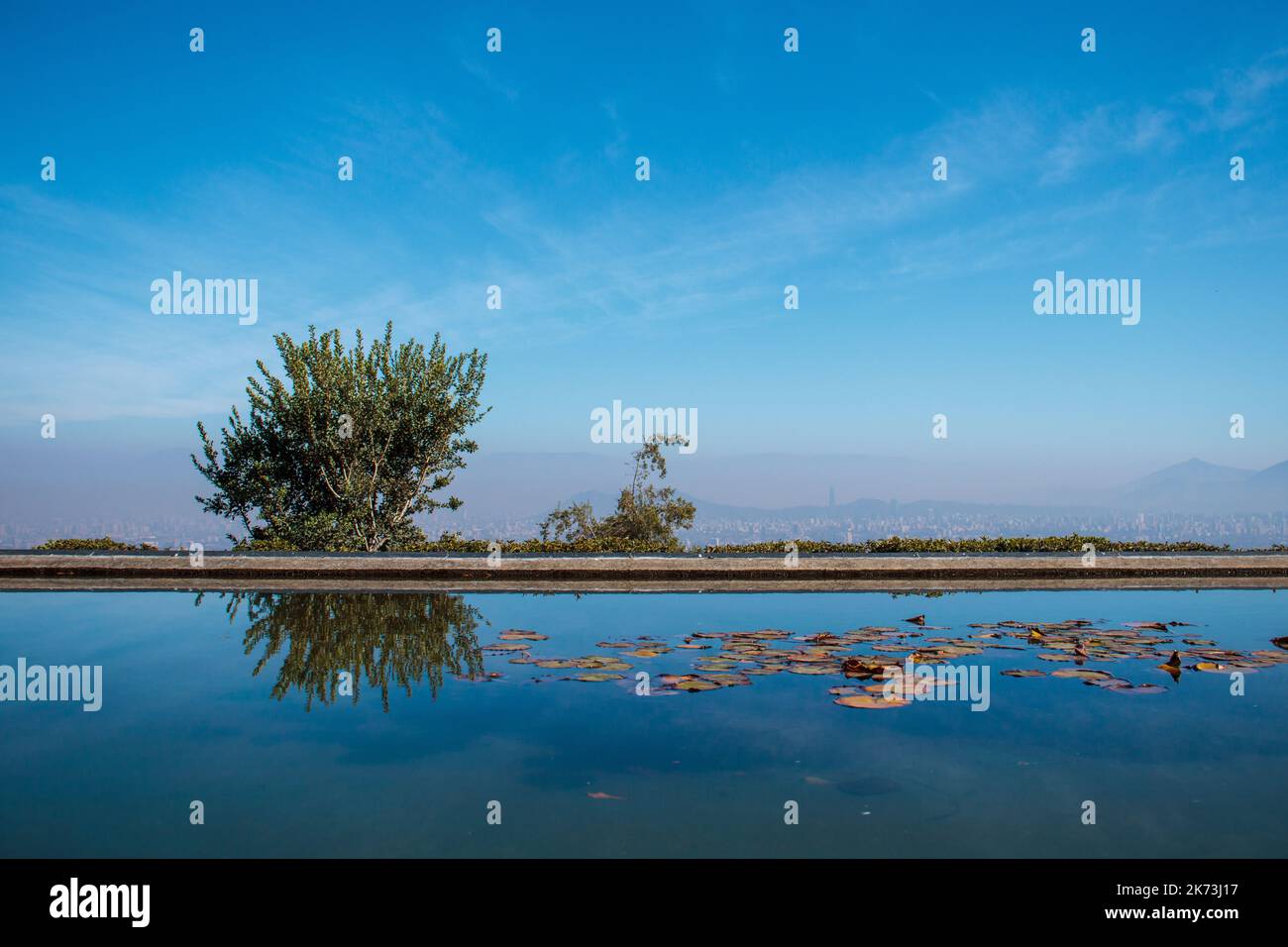 Blue sky, reflection pool Stock Photo - Alamy