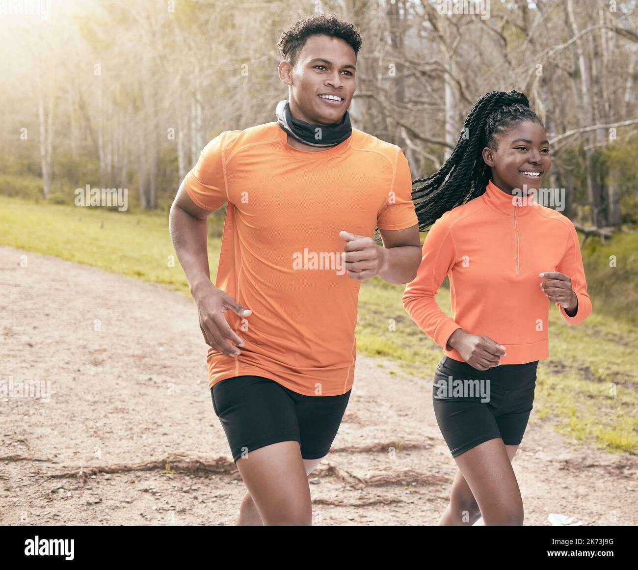 We train better when were together. two young friends running outside ...