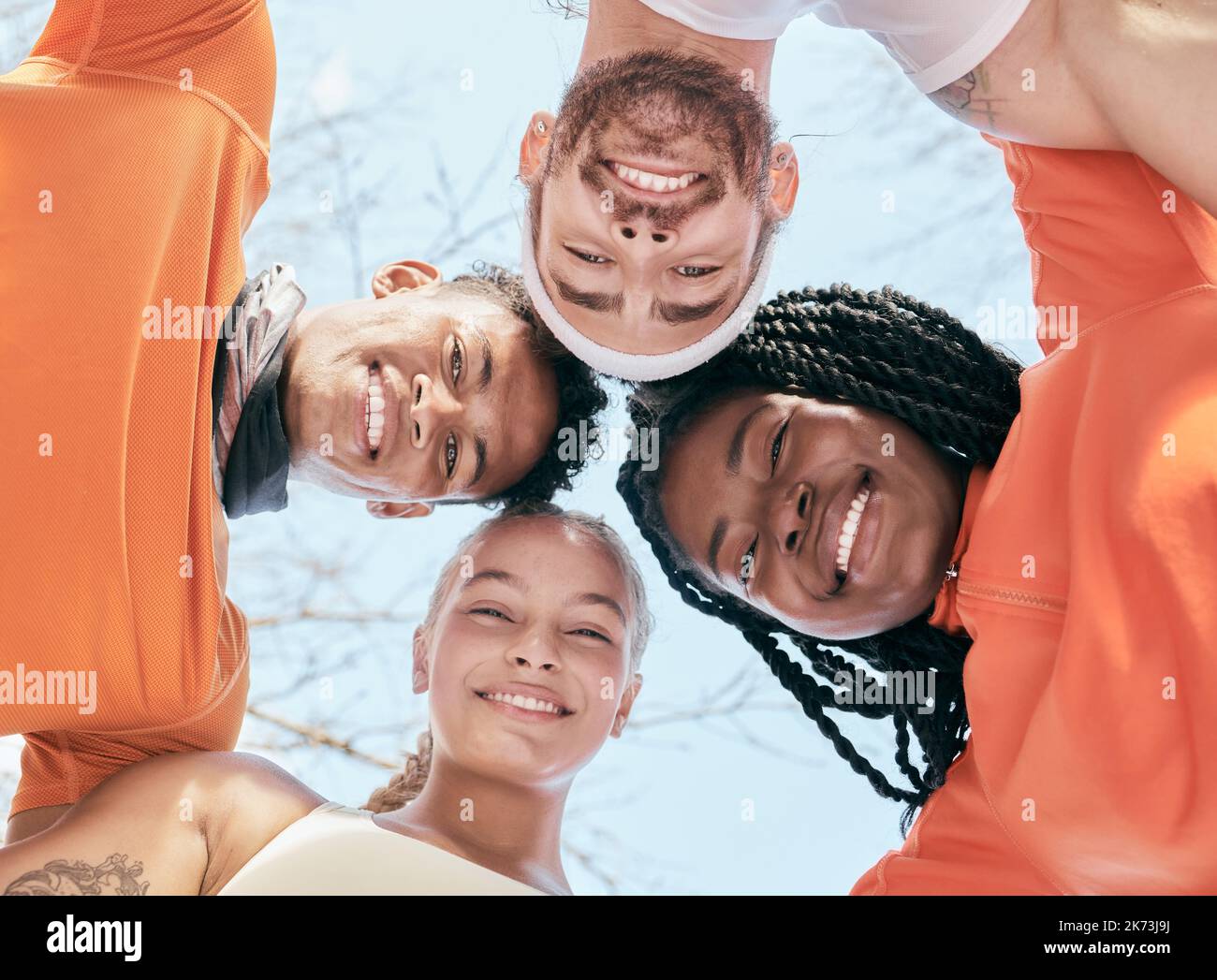 Look at how far weve come together. Low angle shot of a diverse group of friends standing ...