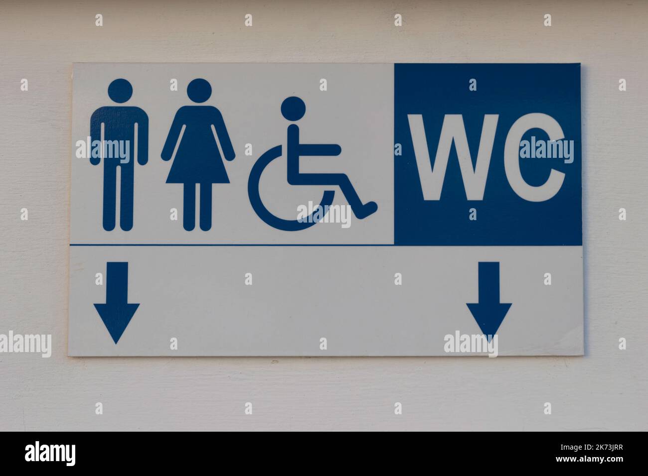 Blue symbols on white background public toilet sign Stock Photo - Alamy