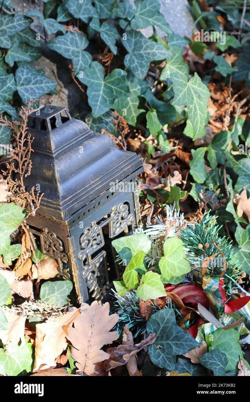 Lantern on the tombstone in the public cemetery Stock Photo - Alamy