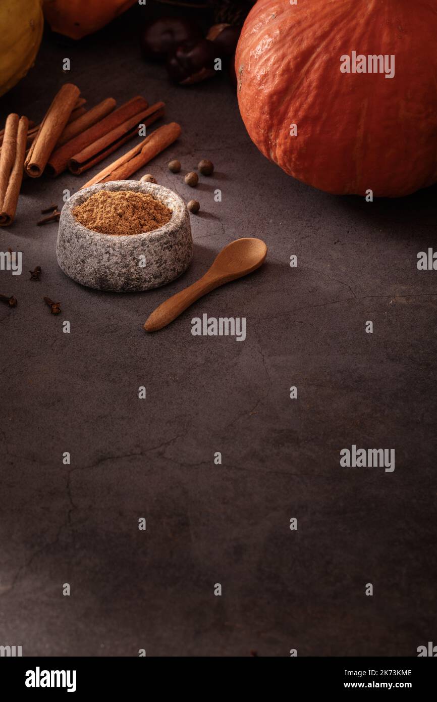 Preparing homemade pumpkin spice from scratch on dark background and ...