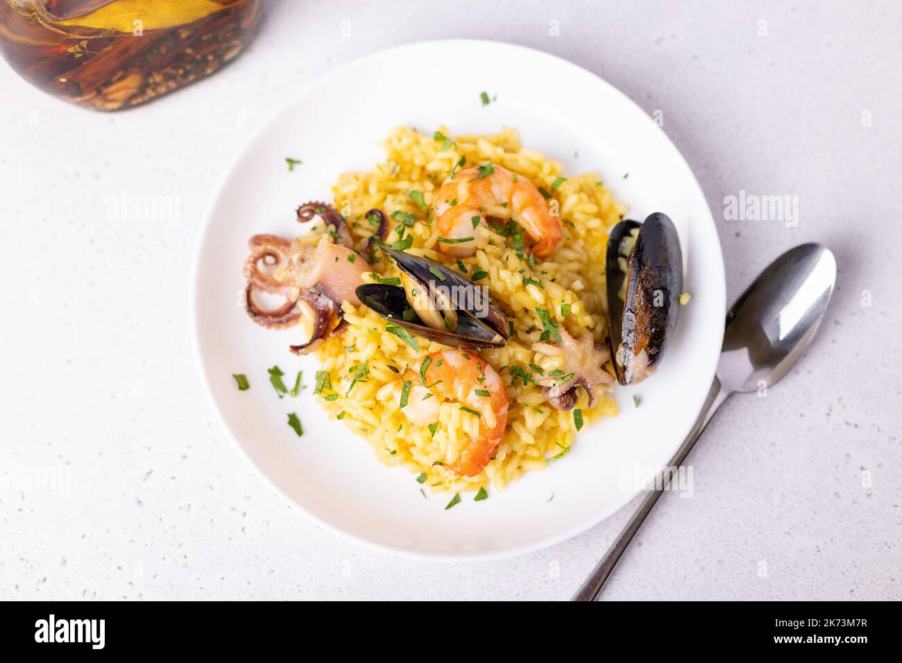 Seafood risotto with saffron and parsley. Arborio rice with tiger ...