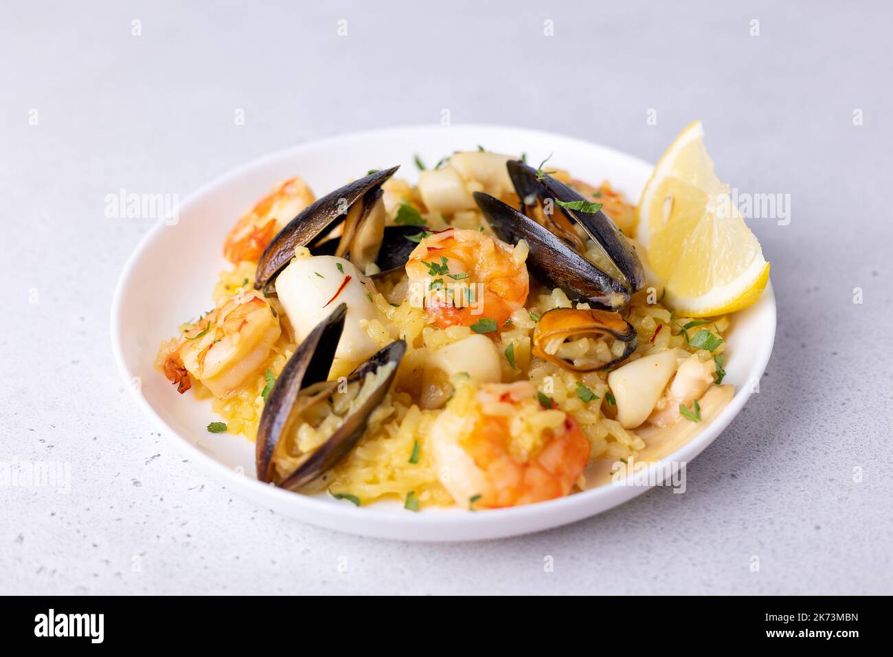 Seafood risotto with saffron, parsley and lemon. Arborio rice with ...