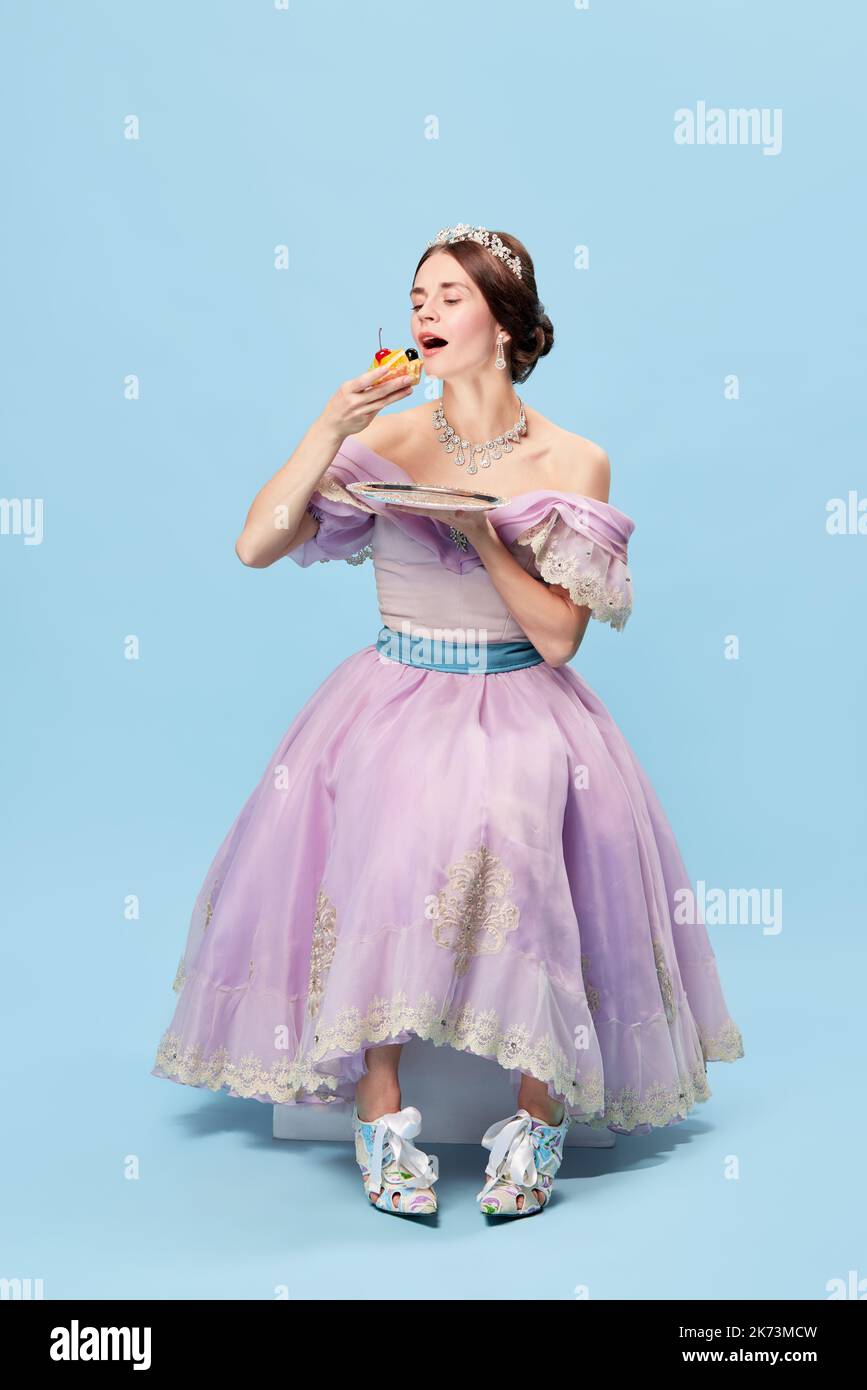 Beautiful charming girl in lilac color medieval dress as young queen or ...