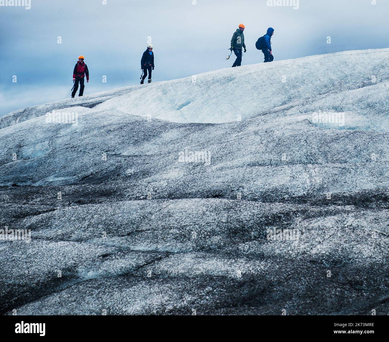 Hikers walking along the Glaciers of Skaftafell national park ...