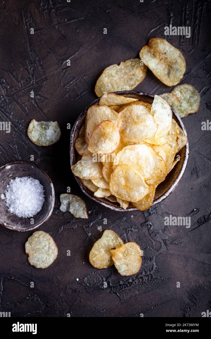 Crispy potato chips with salt Stock Photo - Alamy