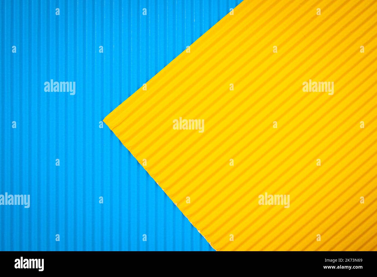 Background texture of corrugated blue and yellow cardboard. Decorative ...