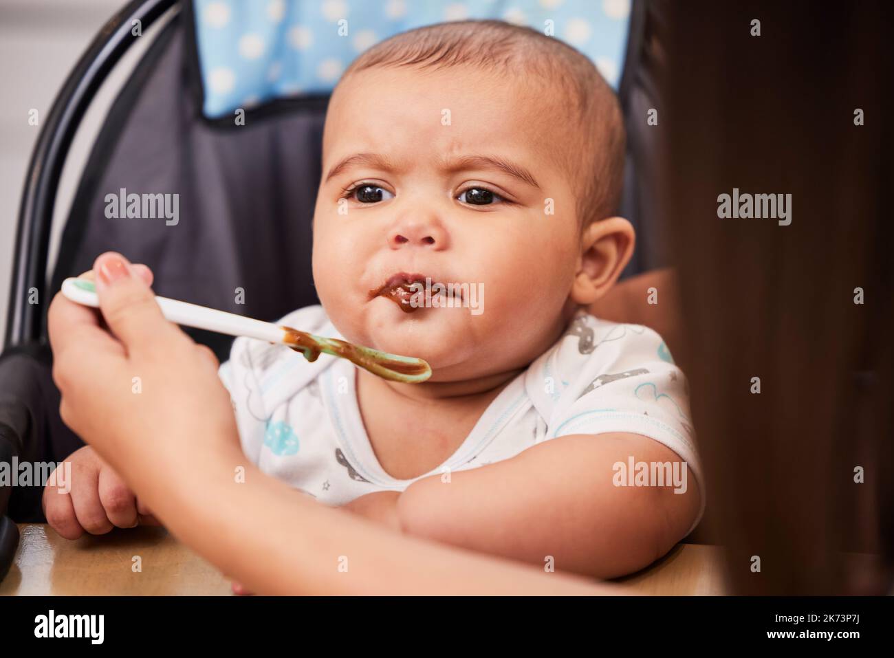 Im not sure how I feel about the one. a mother feeding her adorable ...