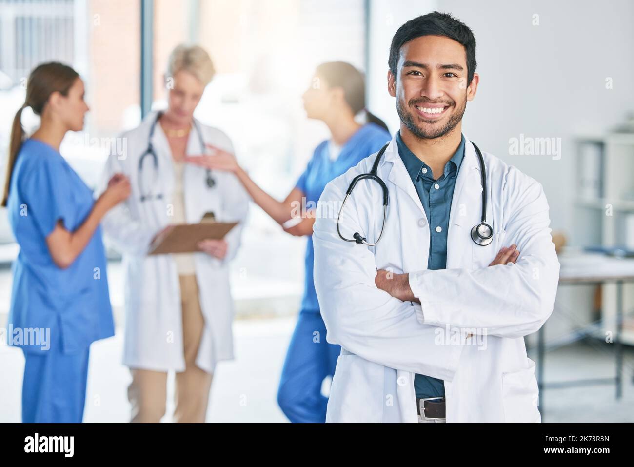 Things may come to those who wait. a young male doctor standing in a ...