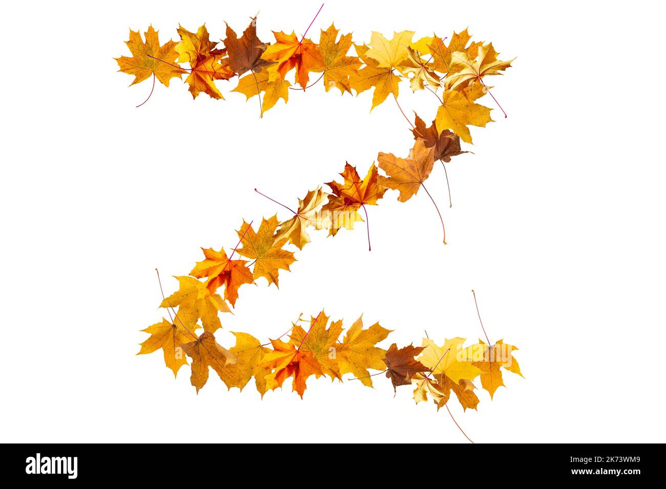 Alphabet letters made with yellow autumn leaves to form the capitals on ...