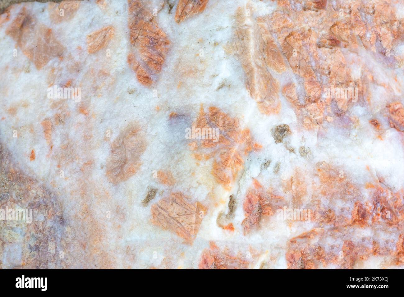 Stone texture background. On a white stone, veins and blotches of light ...