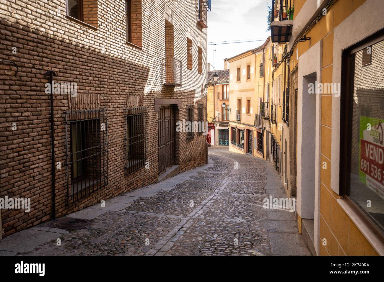 A narrow stone-laid street in Toledo, Spain Stock Photo - Alamy