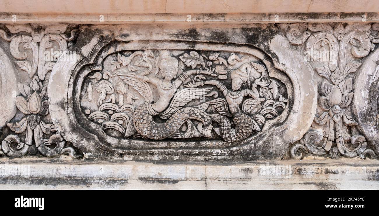 Ancient bas-relief stucco of two mythological half woman half fish ...
